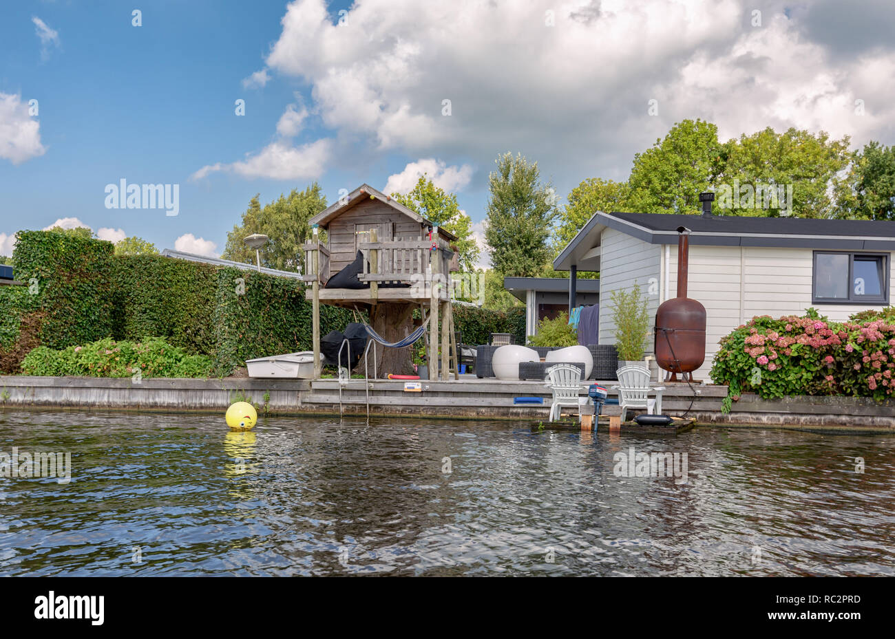 Loosdrecht, Netherlands – September 3 , 2017: Wooden playhous next to a ...