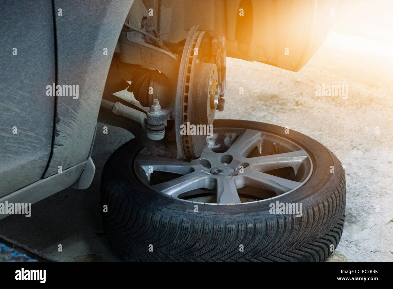 car brake part at garage, car brake disc without wheels closeup Stock ...