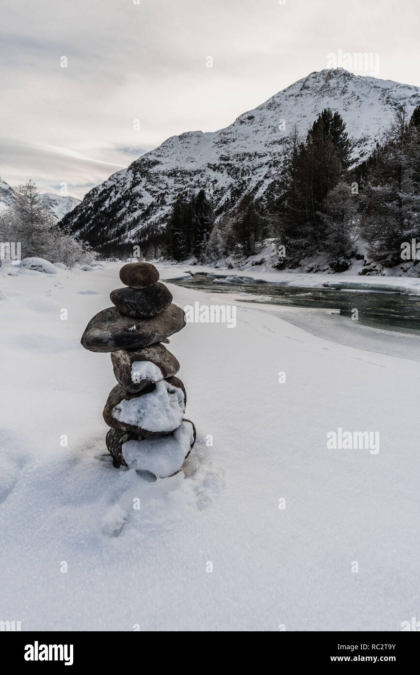 Stone figure in a frozen winterwonderland Stock Photo - Alamy
