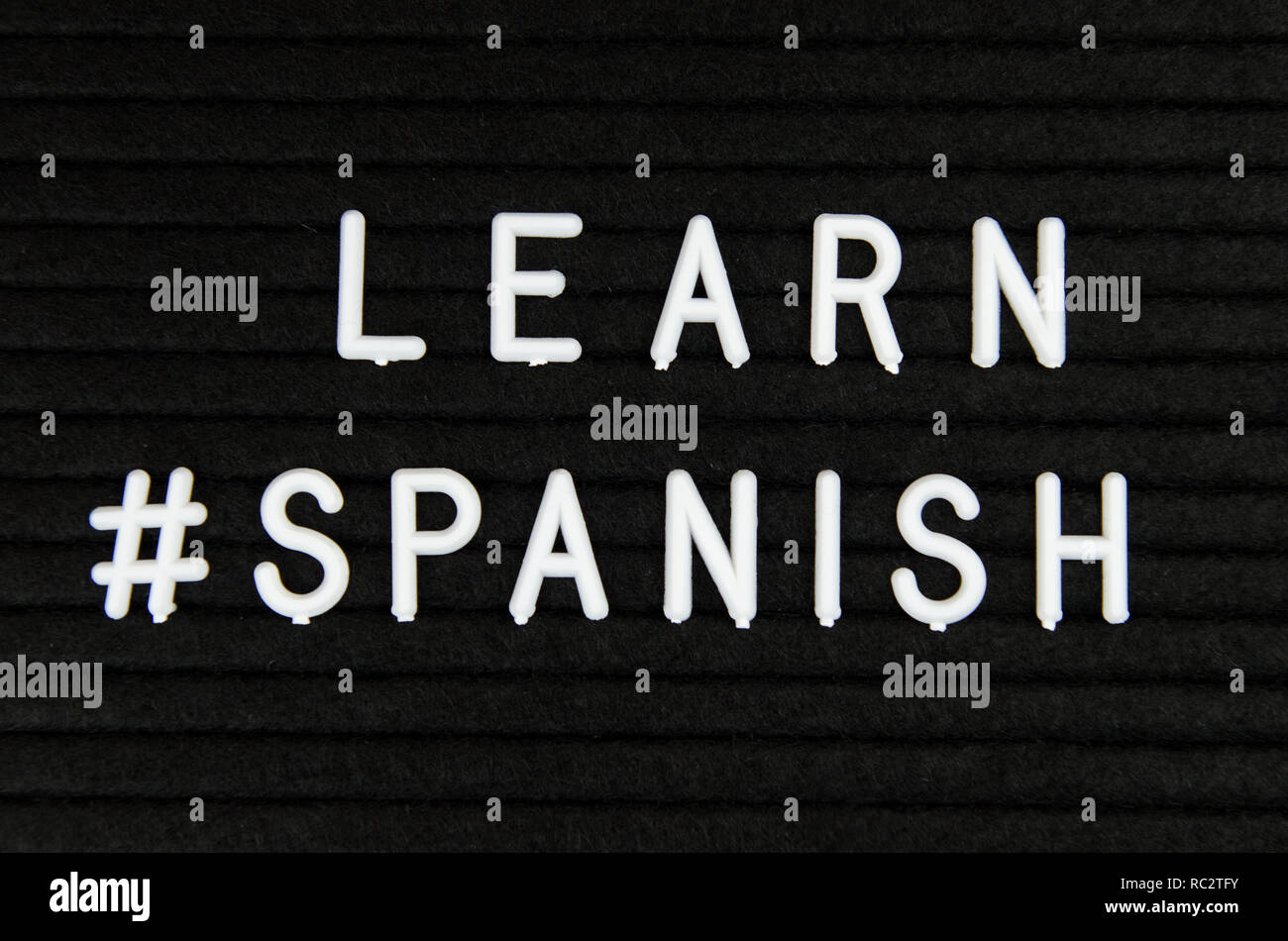 Learn languages sign on black background Stock Photo - Alamy