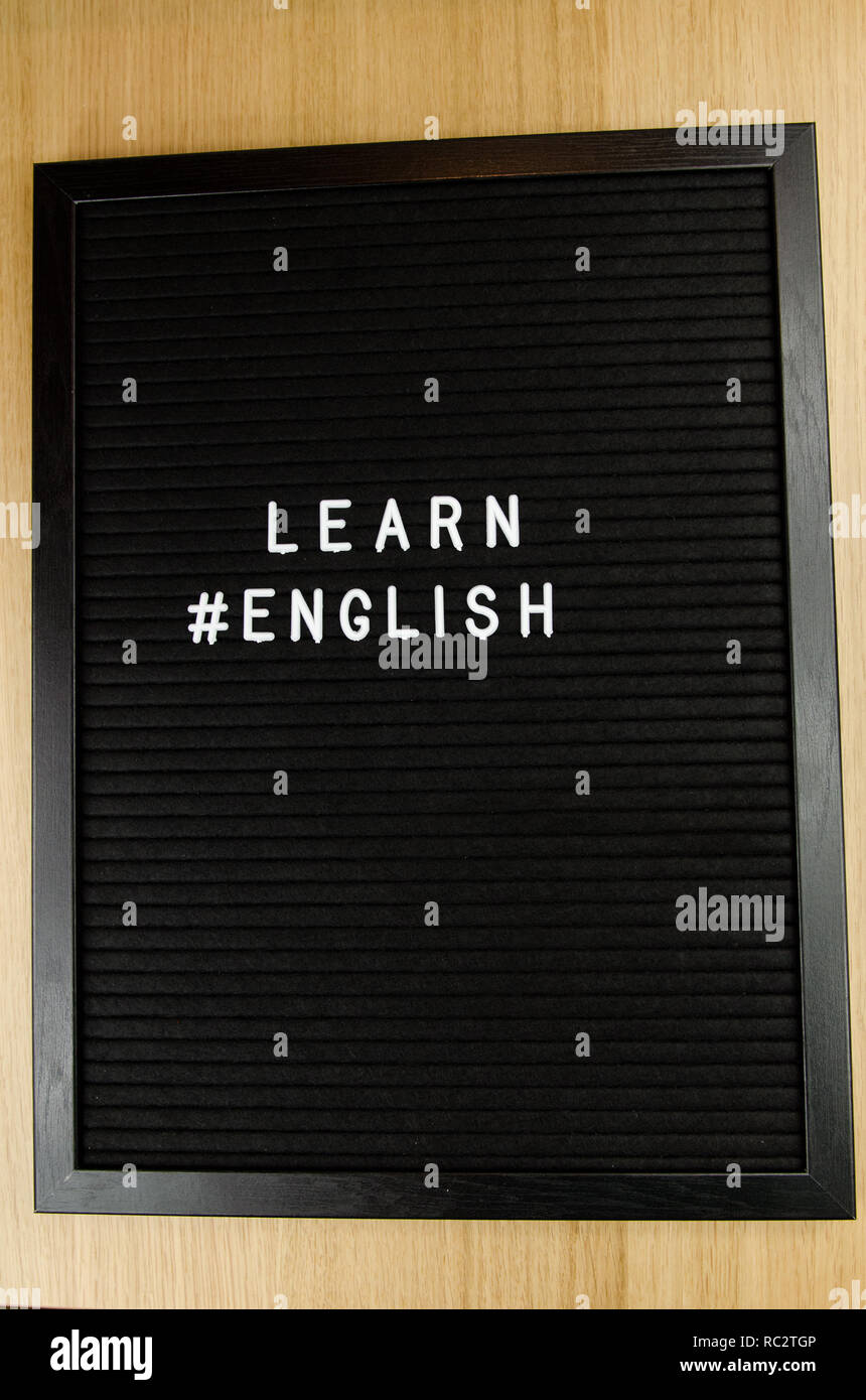 Learn languages sign on black background Stock Photo - Alamy