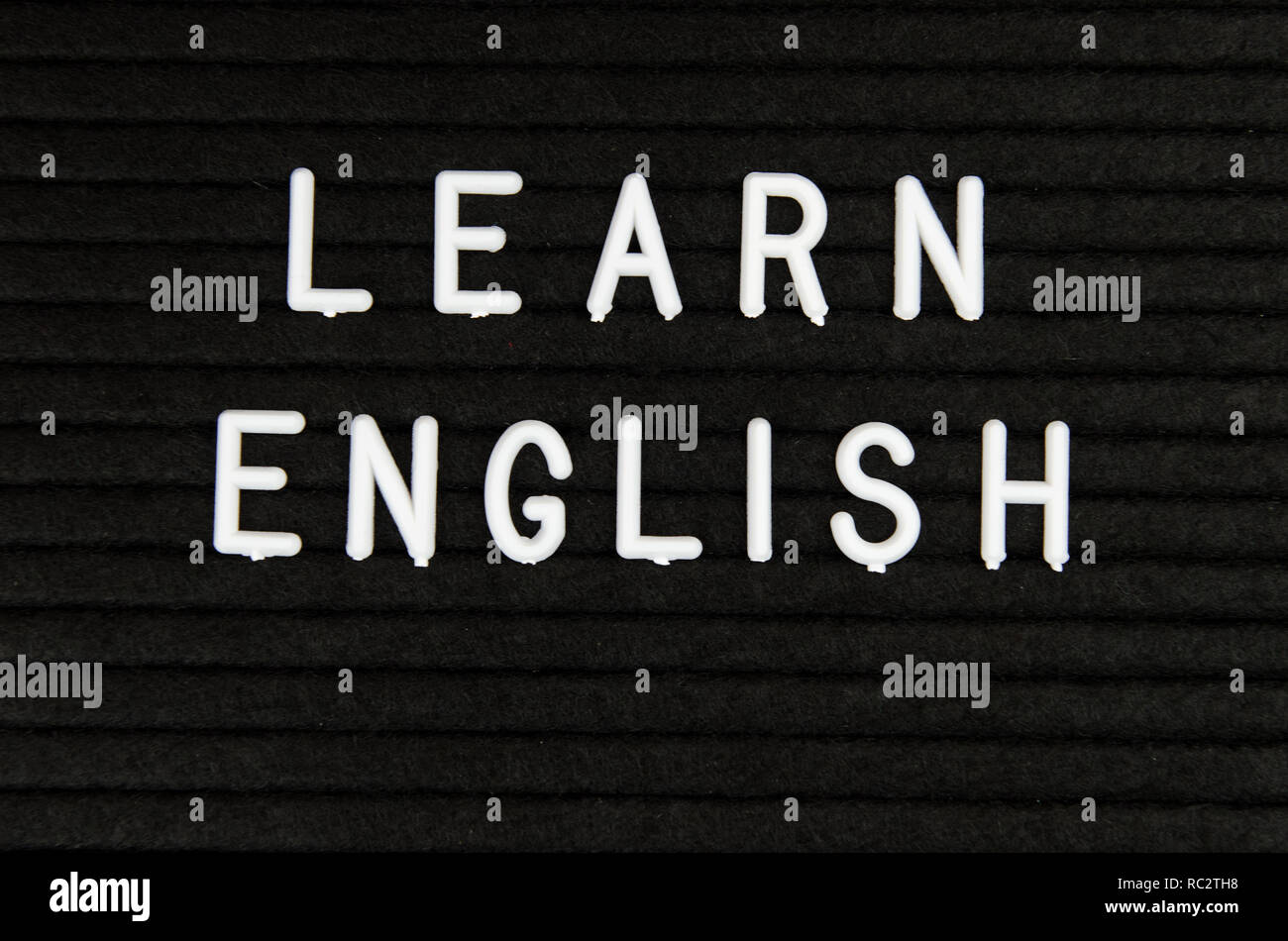 Learn languages sign on black background Stock Photo - Alamy