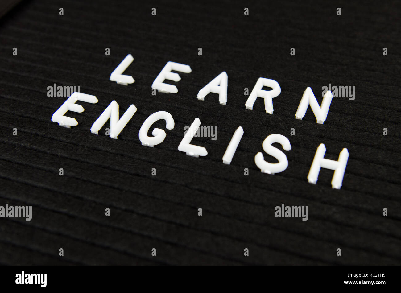 Learn languages sign on black background Stock Photo - Alamy