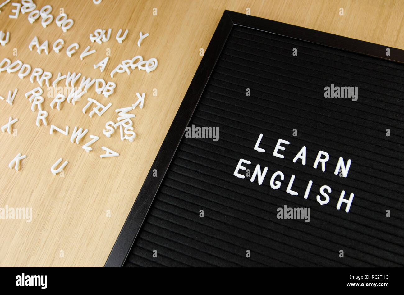 Learn languages sign on black background Stock Photo - Alamy