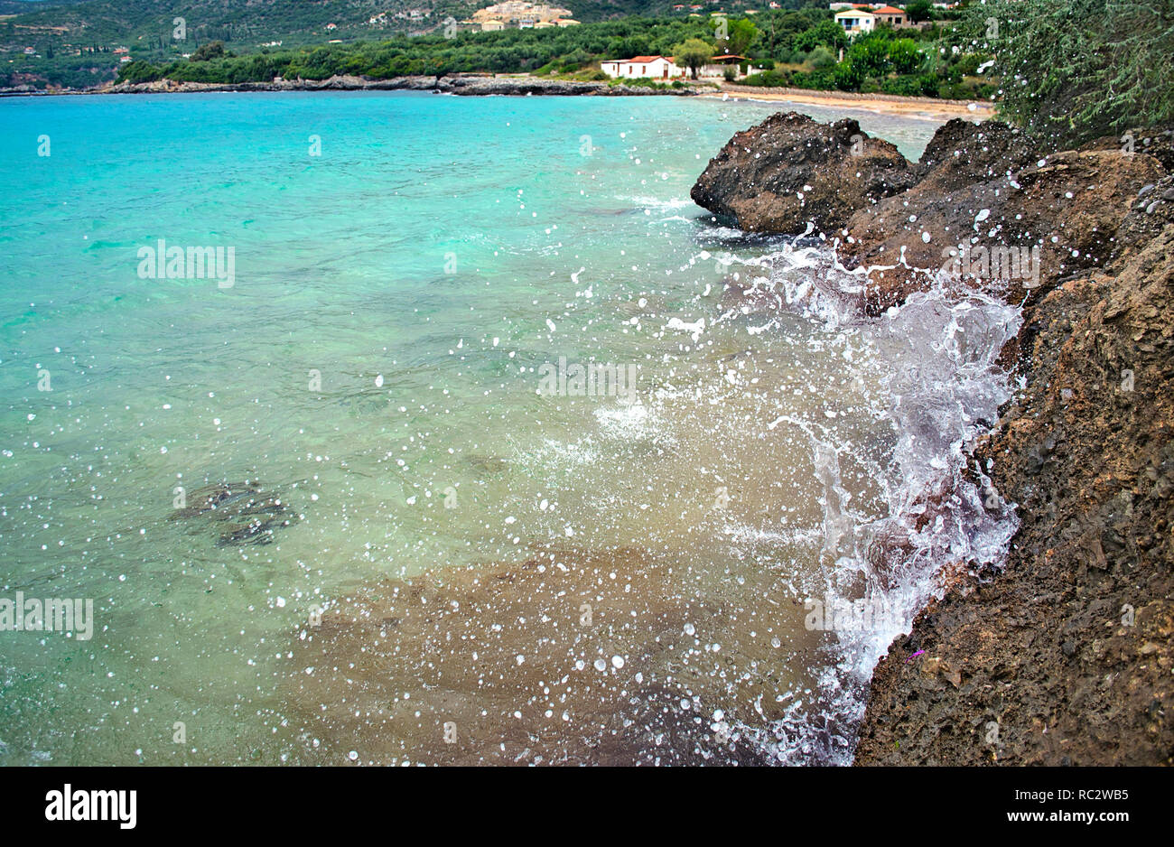beach waves on the rocks at Stoupa beach Messinia Peloponnese Greece ...