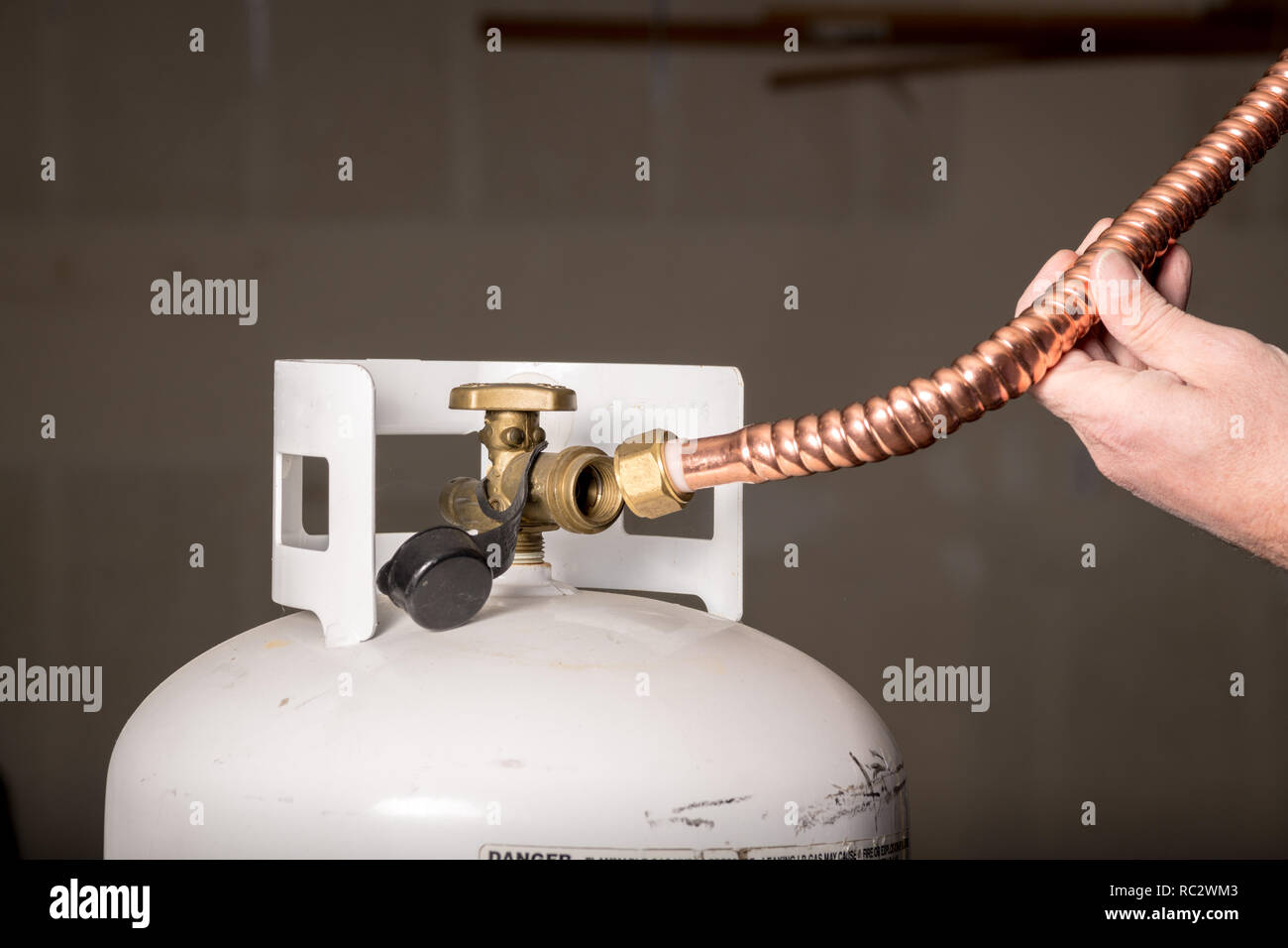 Close up of a propane tank as a pipe is trying to attach Stock Photo ...