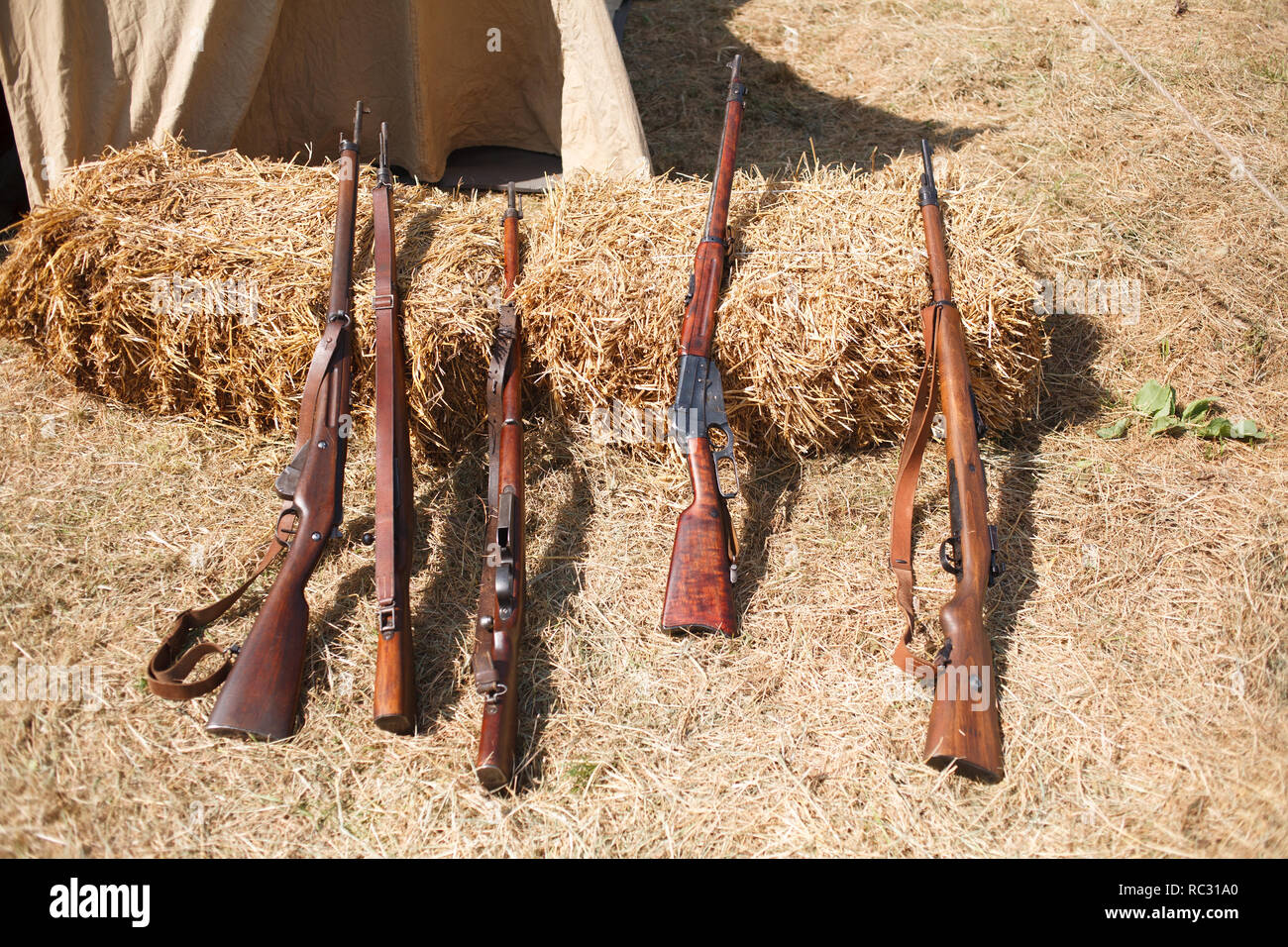 Rifles pyramids with ammunition, First World War-era reenactment Stock ...