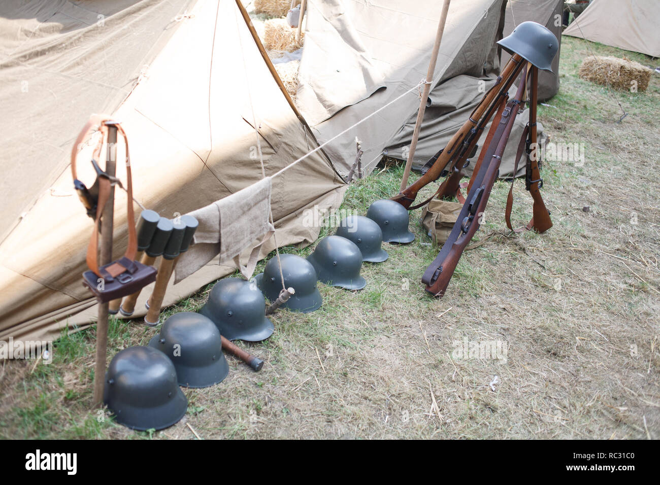 Rifles pyramids with ammunition and german steel helmet, First World ...