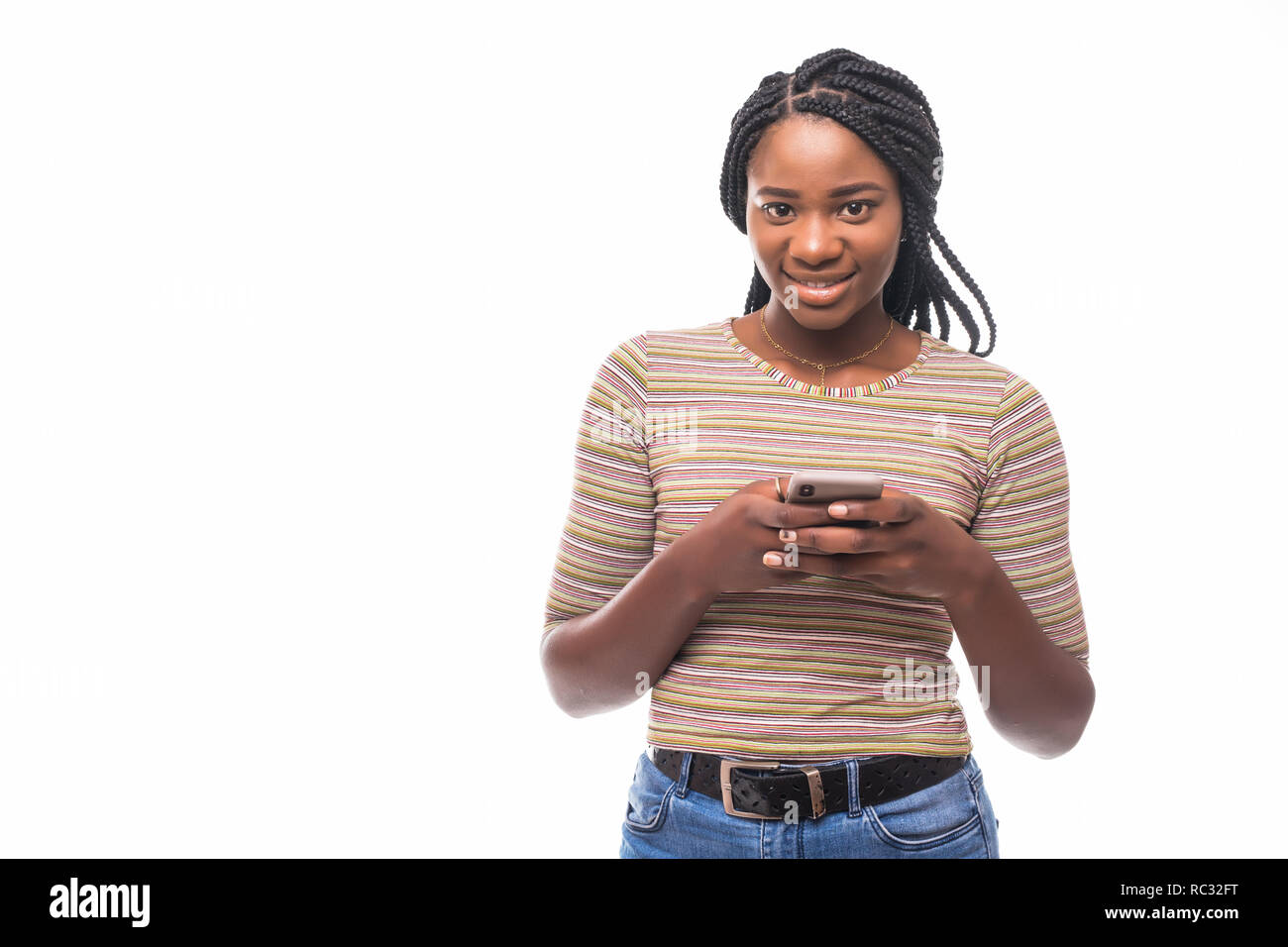 Excited woman texting on her phone over white background Stock Photo ...