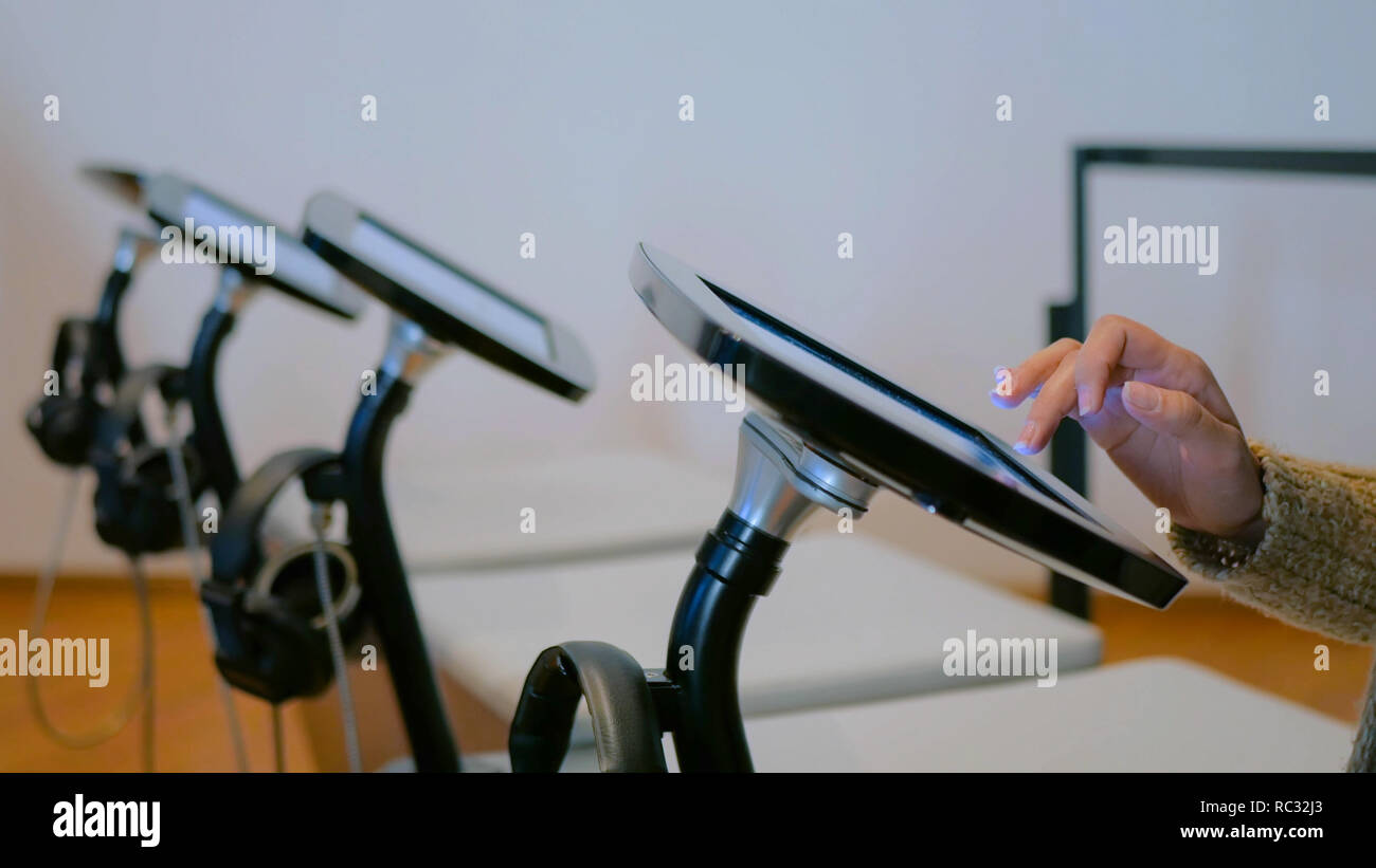 Close up shot - woman using interactive touchscreen display tablet at ...
