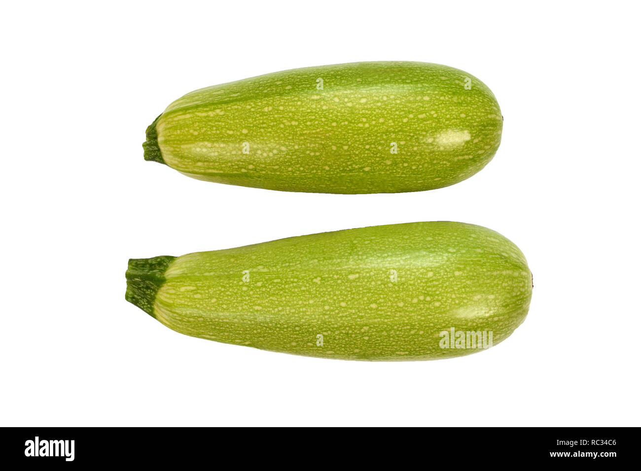 Two zucchini, top view, isolated on white background. Fresh vegetables ...