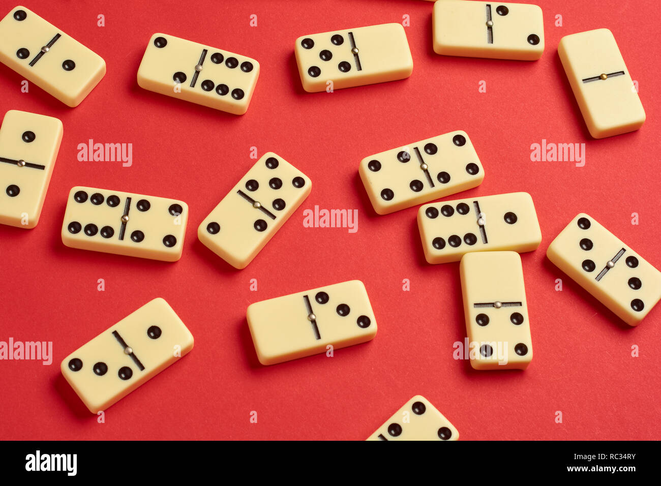 Domino game, colorful background with domino pieces on red Stock Photo ...