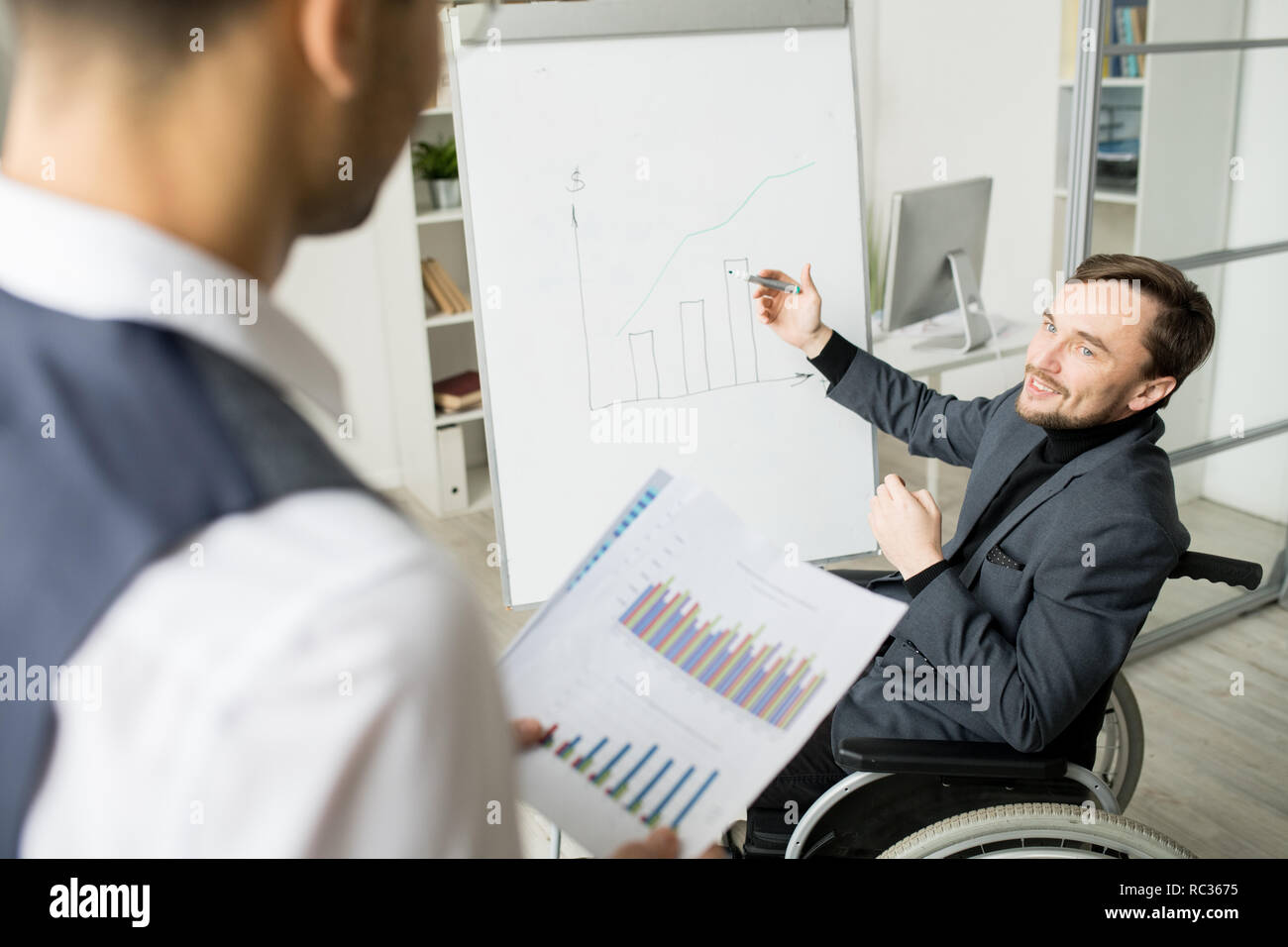 Businessman presenting his report Stock Photo - Alamy