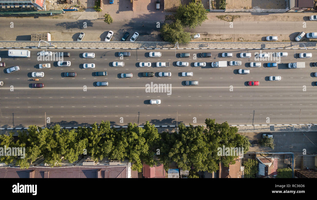 Aerial Drone Flight top down View of freeway busy city rush hour heavy ...
