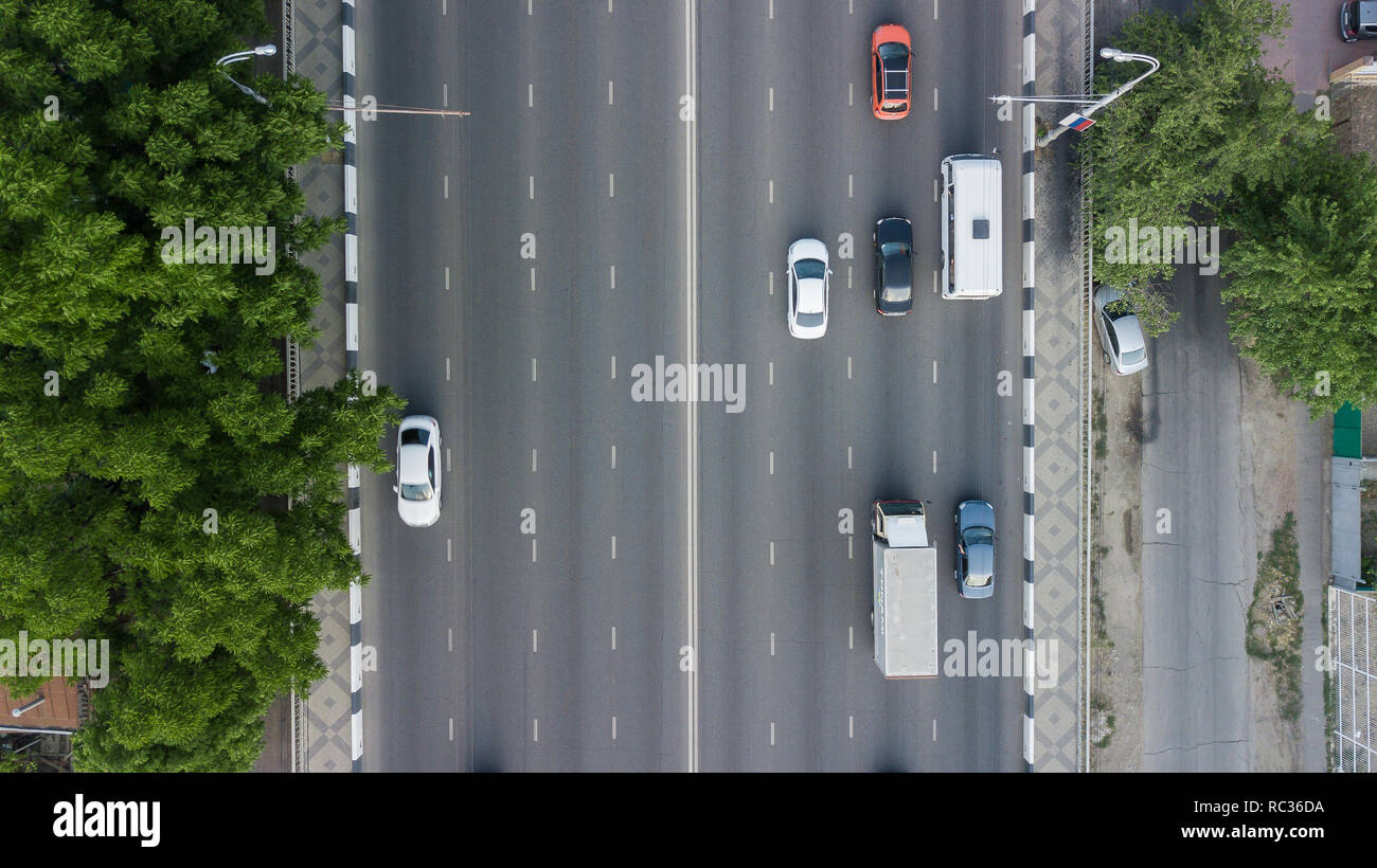 Aerial Drone Flight top down View of freeway busy city rush hour heavy ...