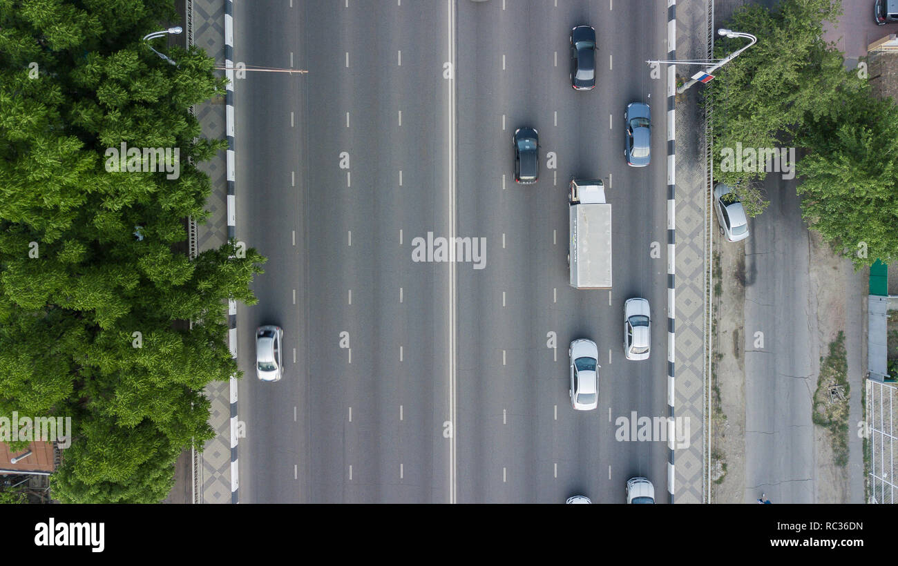 Aerial Drone Flight top down View of freeway busy city rush hour heavy ...