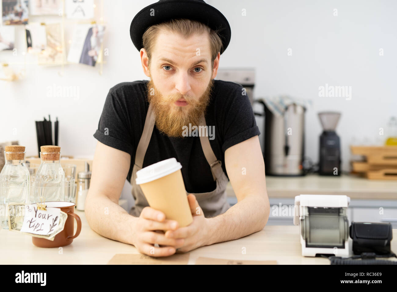 Handsome barista in hat Stock Photo - Alamy