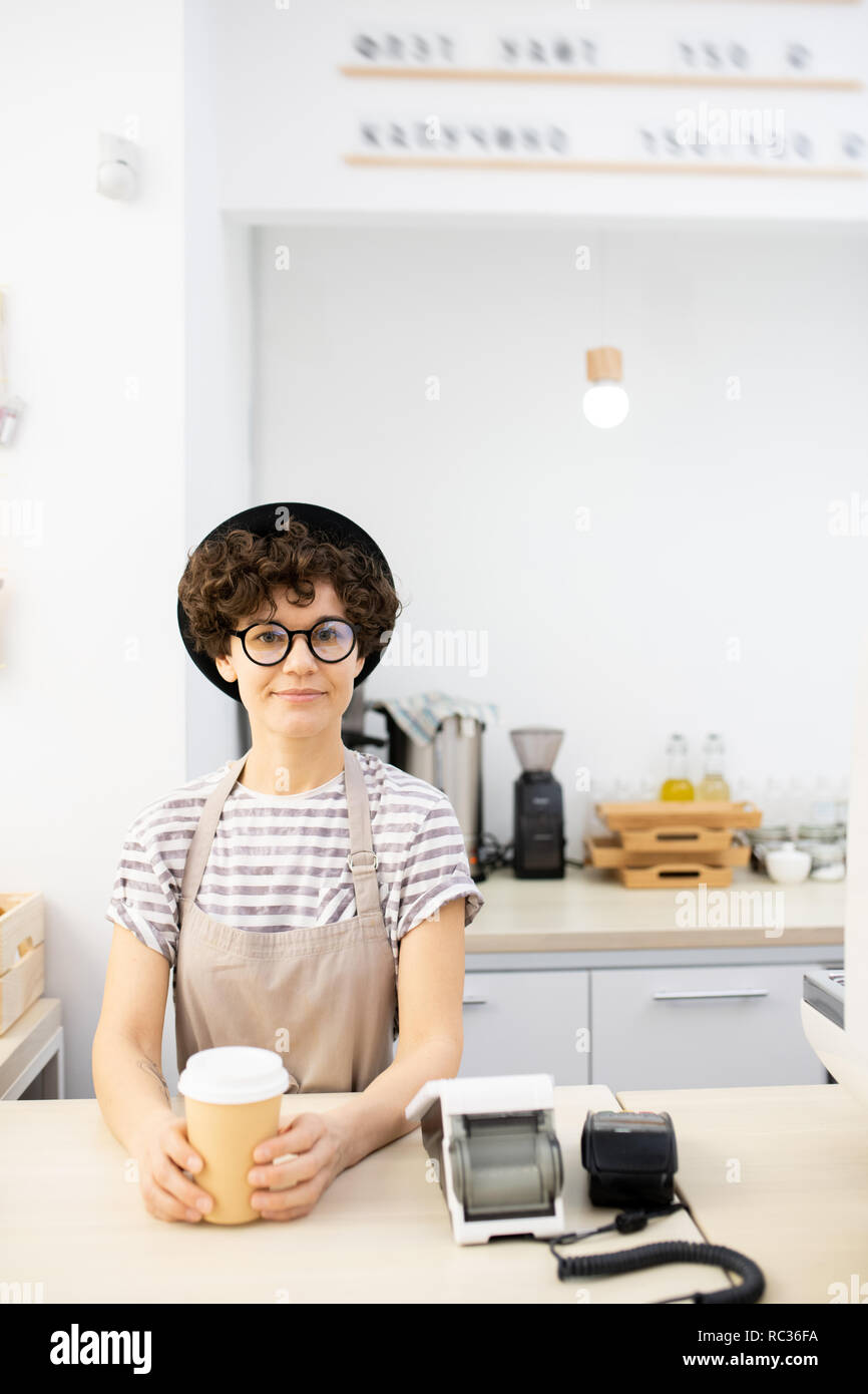 Beautiful lady in hat standing at counter in coffee house Stock Photo ...