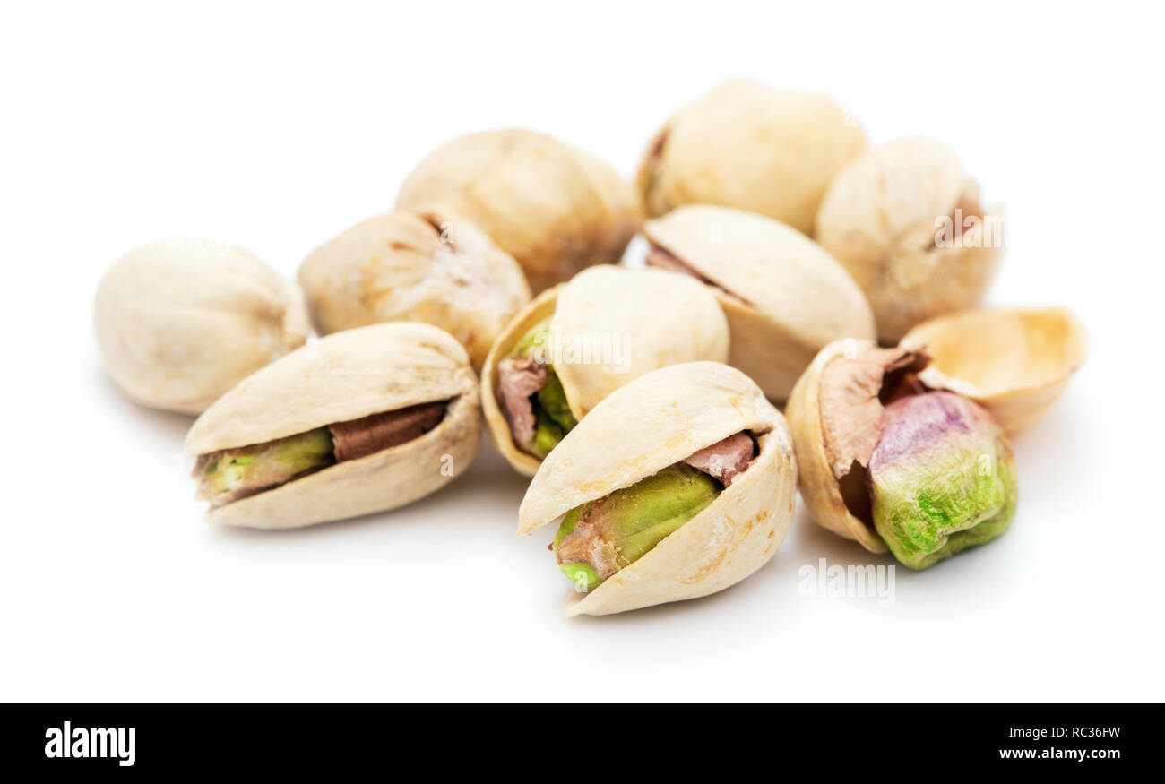 heap of ripe dry pistachios isolated on white background Stock Photo ...