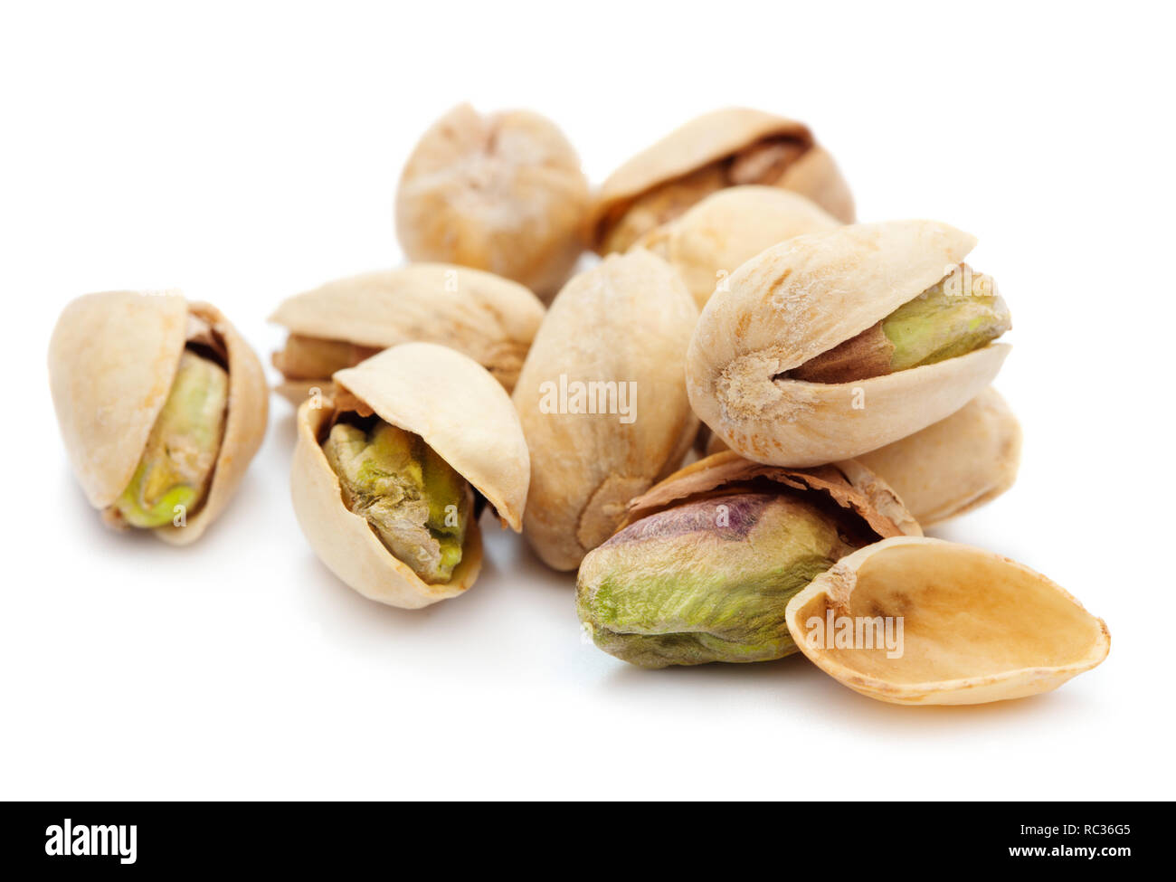 heap of ripe dry pistachios isolated on white background Stock Photo ...