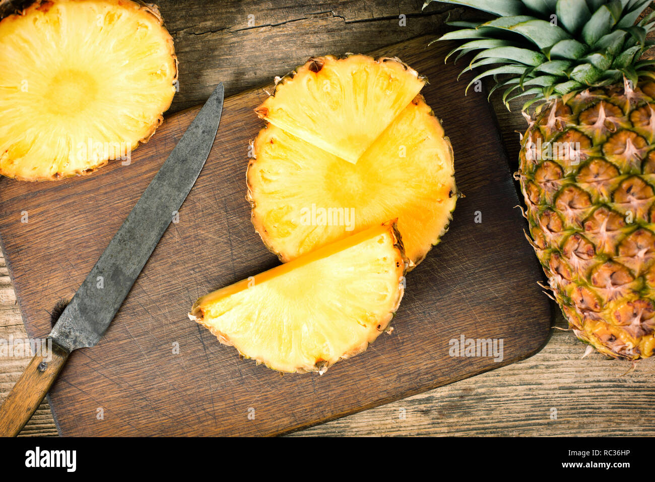 fresh pineapple sliced on wooden background Stock Photo - Alamy