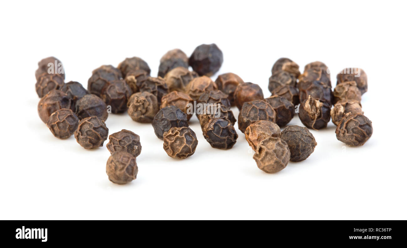 heap of dryed pepper corns isolated on white background Stock Photo - Alamy
