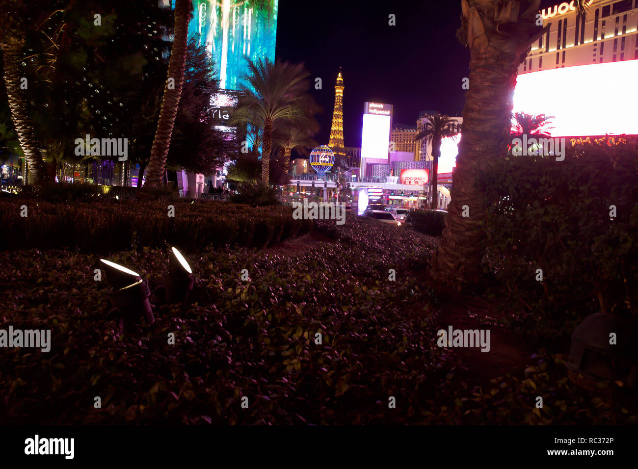 Las Vegas Boulevard famously known as the strip lit up in the evening Stock Photo - Alamy