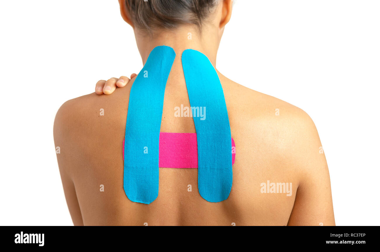 Female back with physio tape on white background Stock Photo - Alamy