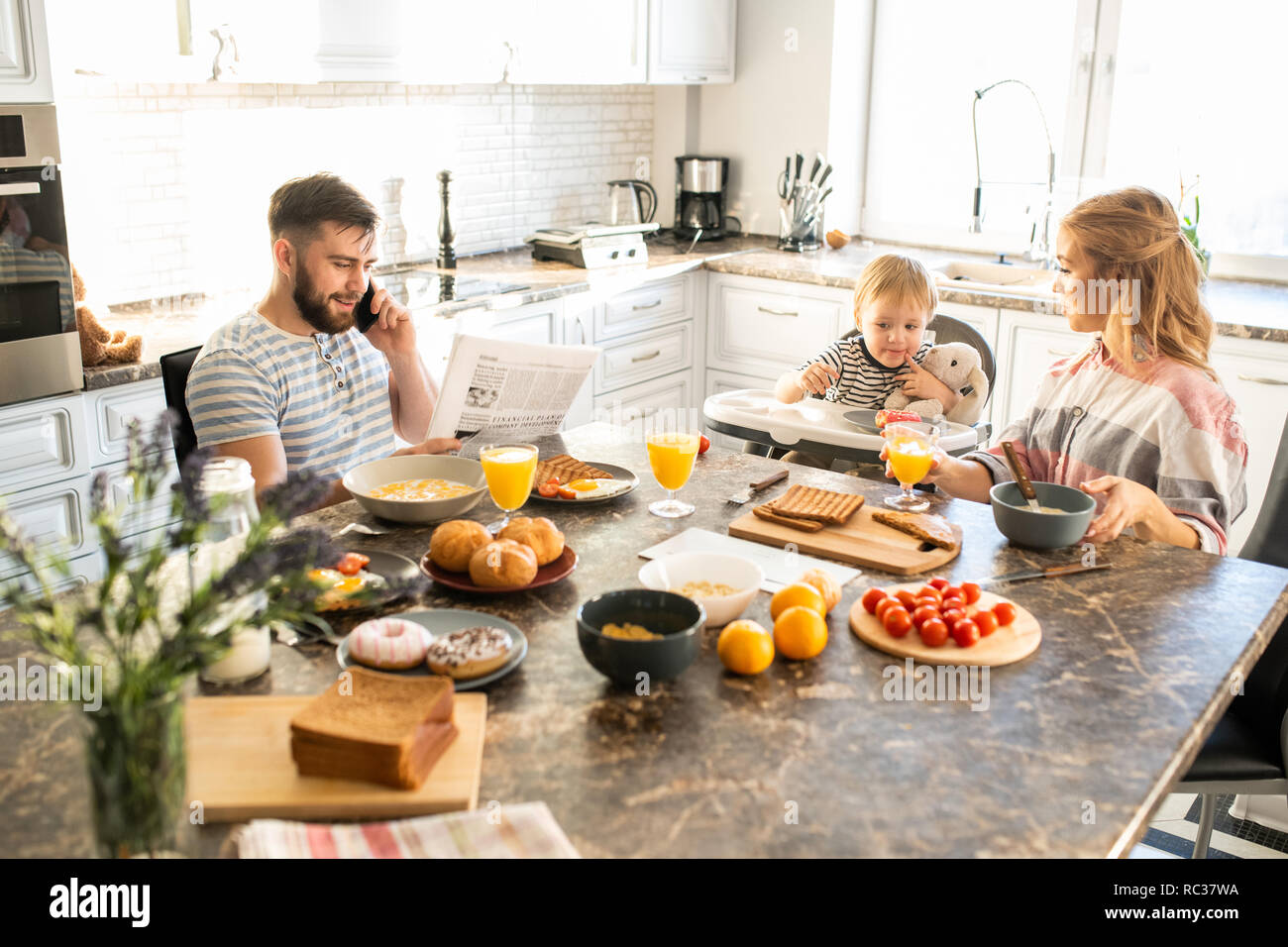 Happy Family in Morning Stock Photo - Alamy