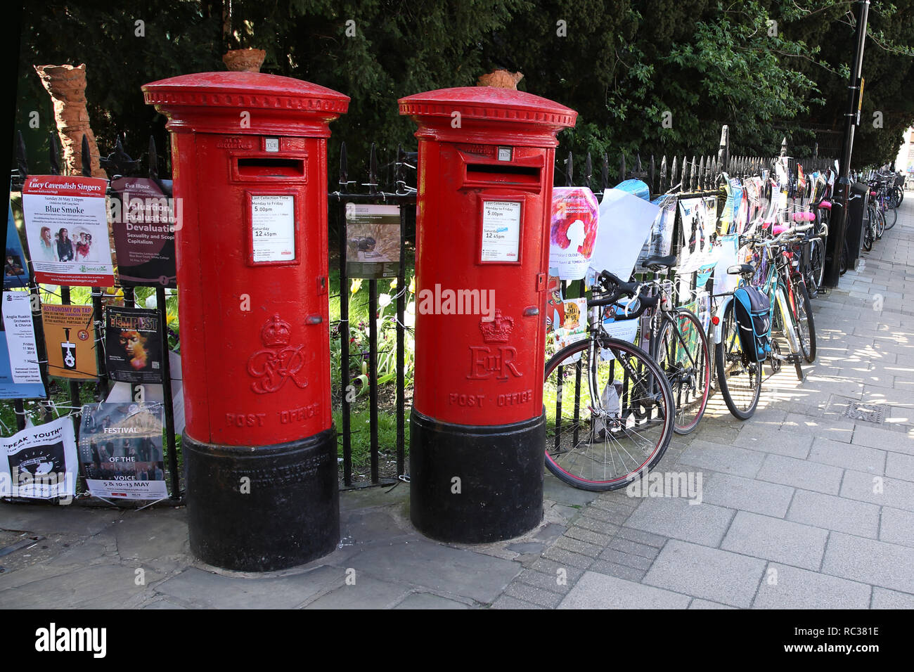 Traditional red pillar boxes on corner of St Johns Street in the city ...