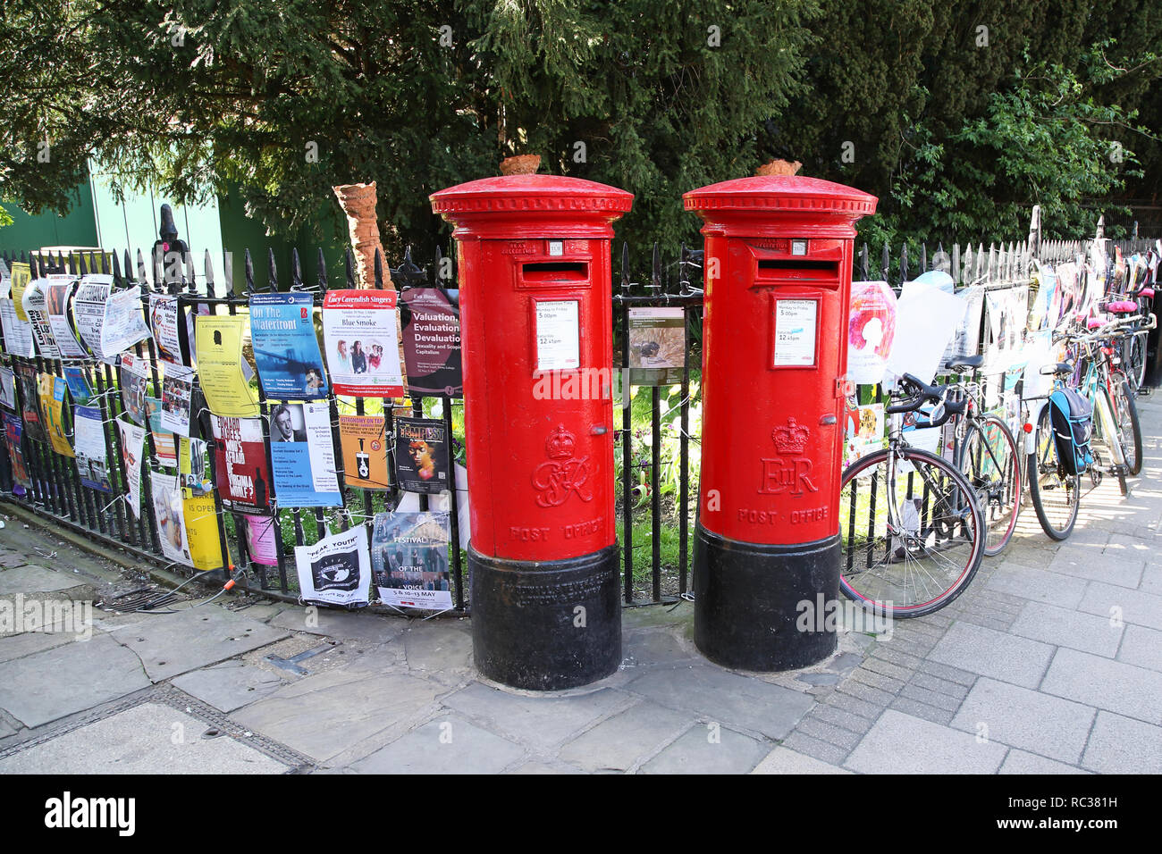 Traditional red pillar boxes on corner of St Johns Street in the city ...