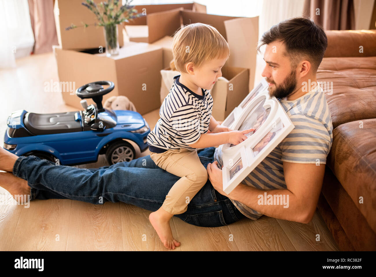 Father and Son Looking at Photos Stock Photo - Alamy