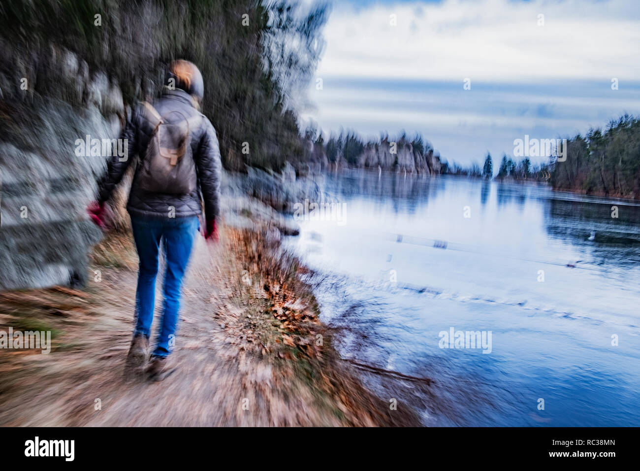 woman hiking on trail near water Stock Photo - Alamy