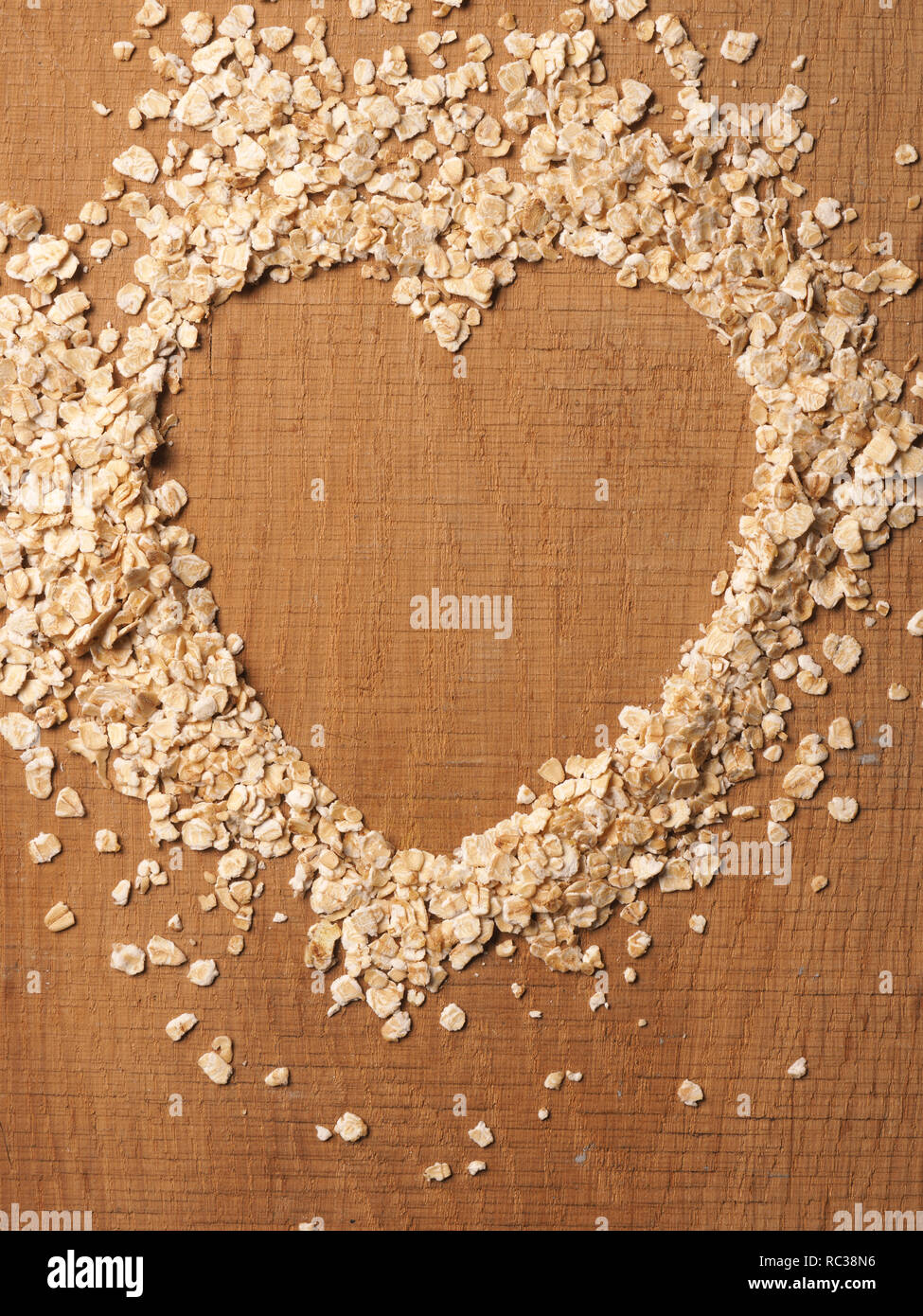Heart shape of organic oat meal on a rustic wooden oak plank Stock ...