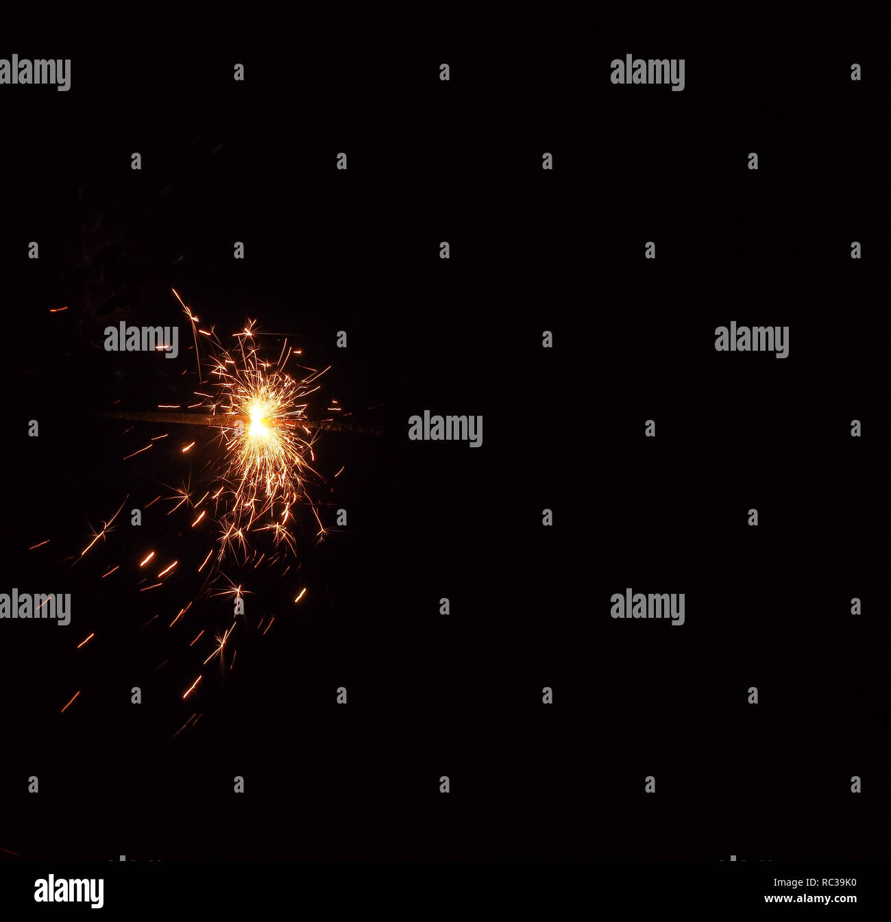 Sparklers in the dark. A sheaf of bright sparks and fire. New year's ...