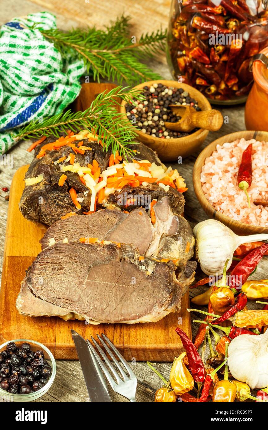 Sliced roast meat from wild boar. Pork baked in the oven. Wild game ...