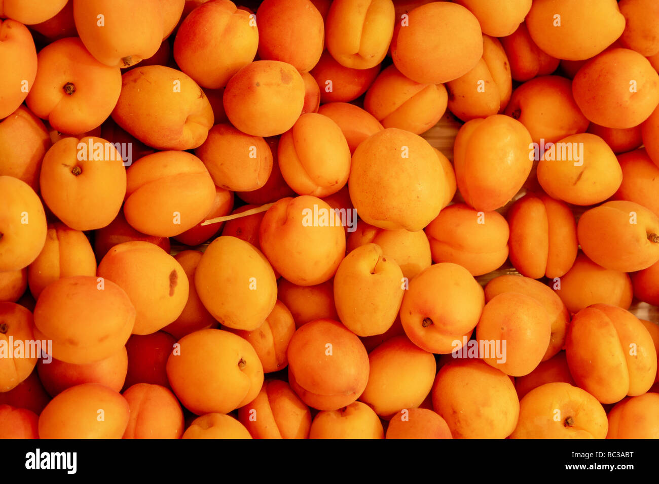 Orange Color Plums In Box On Market Shelves Top View Stock Photo - Alamy