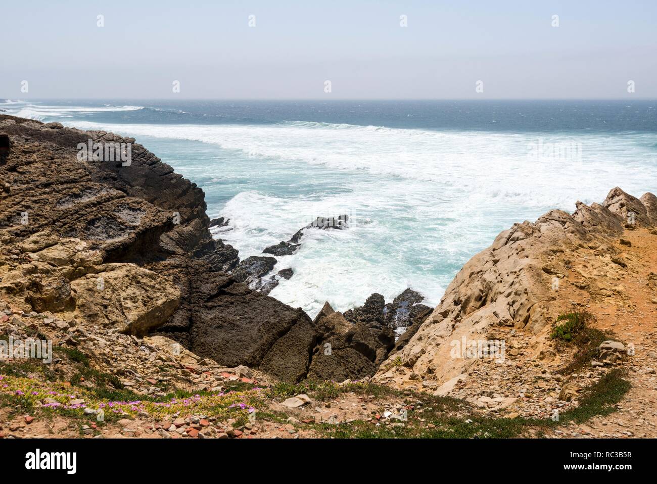The beach of Praia do Guincho is popular for surfing, windsurfing, and ...