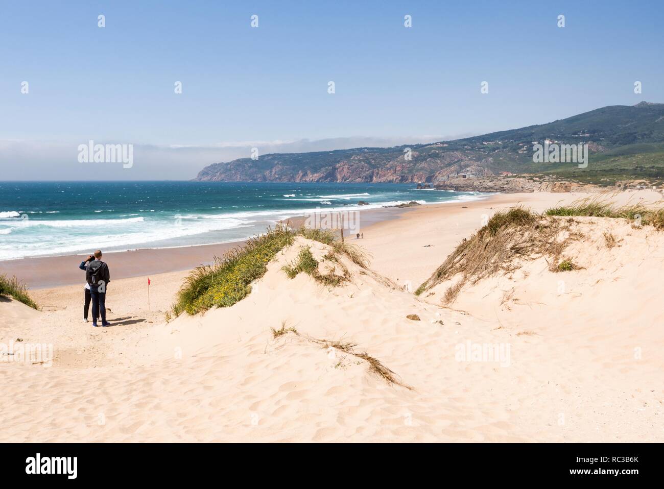 The beach of Praia do Guincho is popular for surfing, windsurfing, and ...