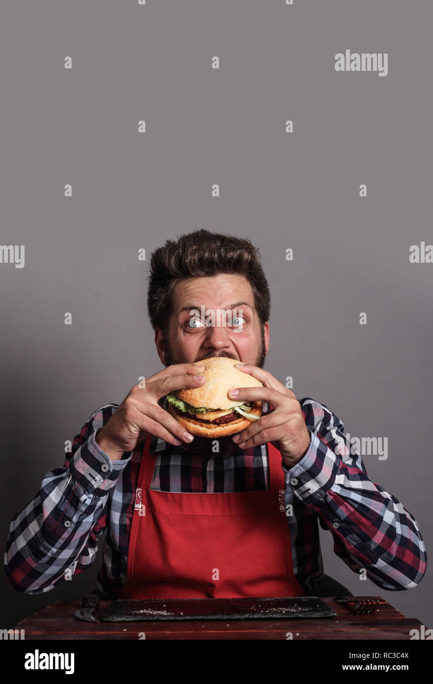 Funny man eating hamburger hi-res stock photography and images - Alamy