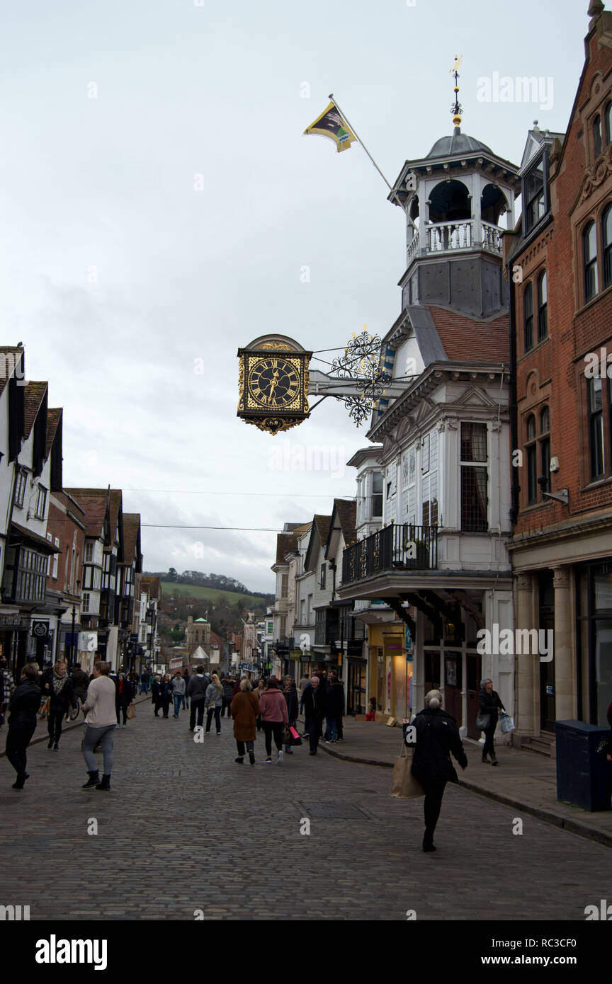 Shoppers on Guildford High Street, with the Guildhall clock visible ...