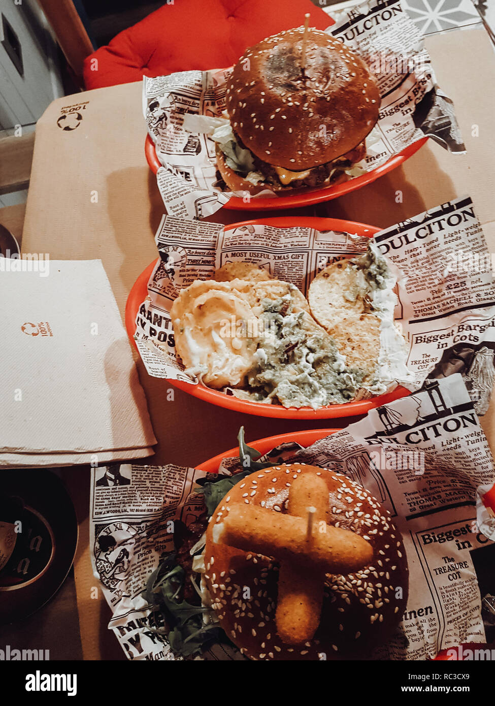 restaurant table with appetizing burgers ready to eat Stock Photo - Alamy