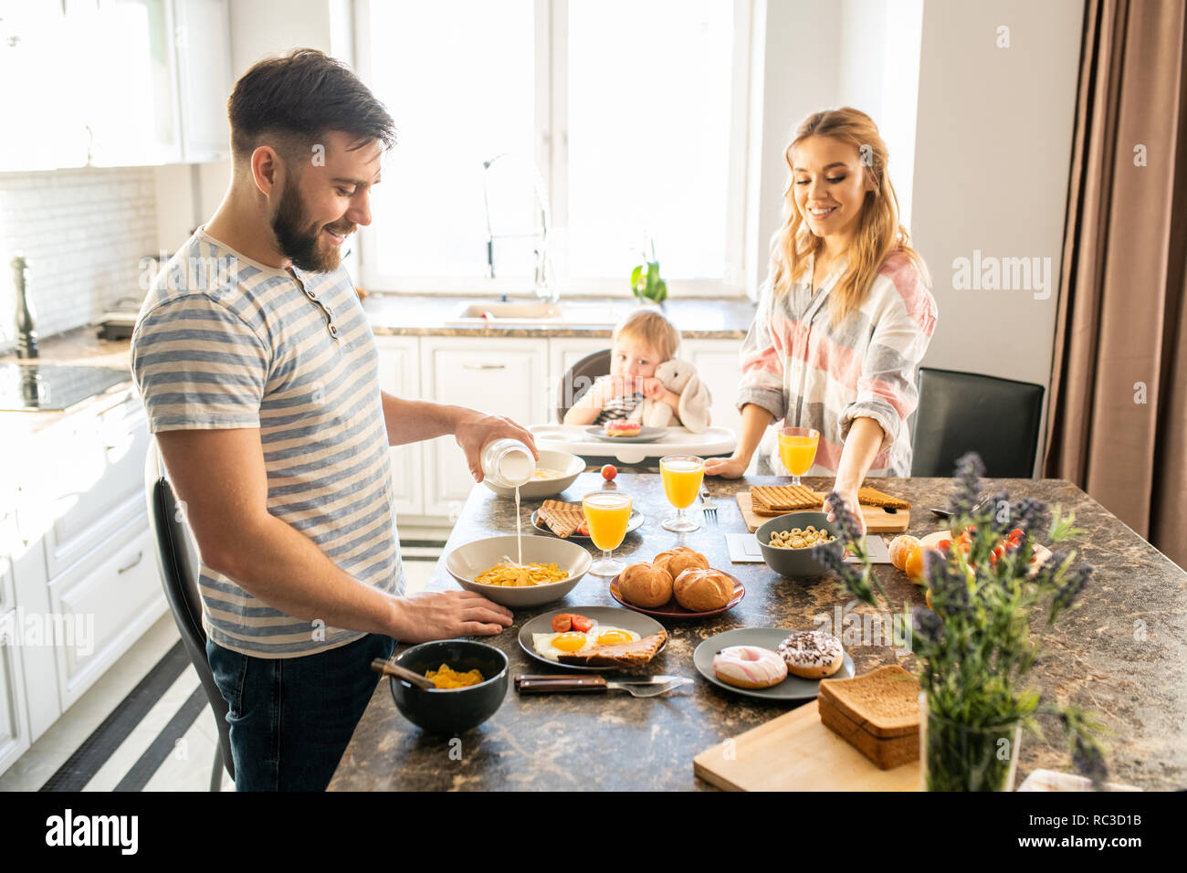 Happy Family in Kitchen Stock Photo - Alamy