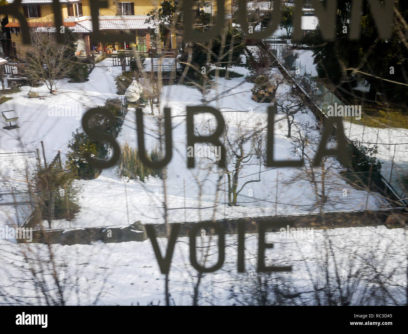 Winter landscape in the Alps, seen through a train window, Domodossola ...