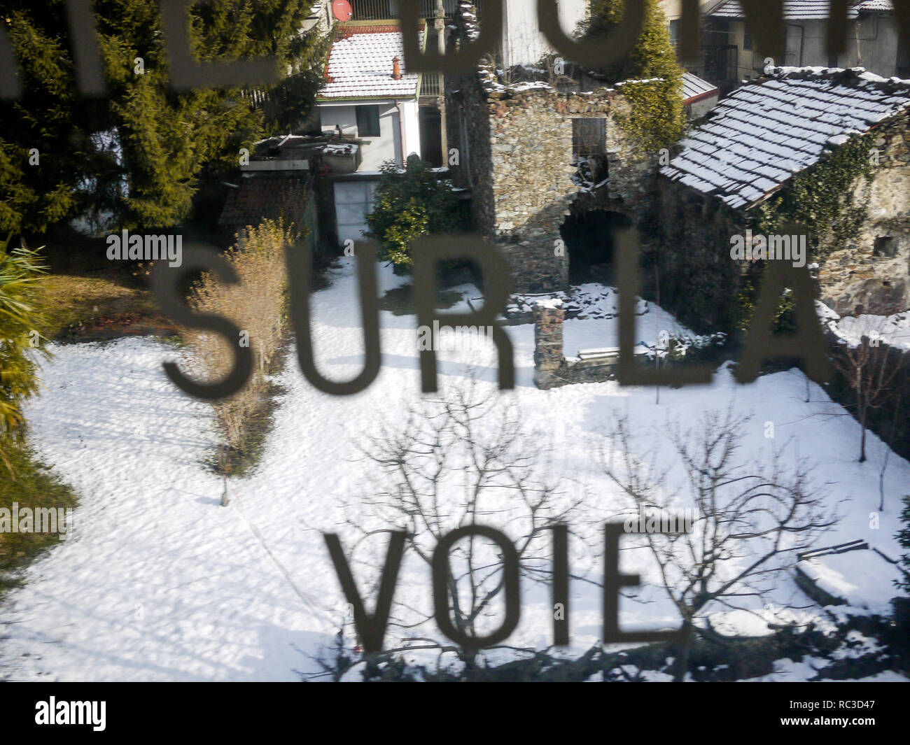 Winter landscape in the Alps, seen through a train window, Domodossola ...