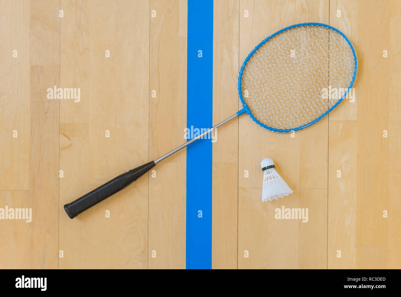 White badminton shuttlecock on a hall floor at badminton courts .Close ...