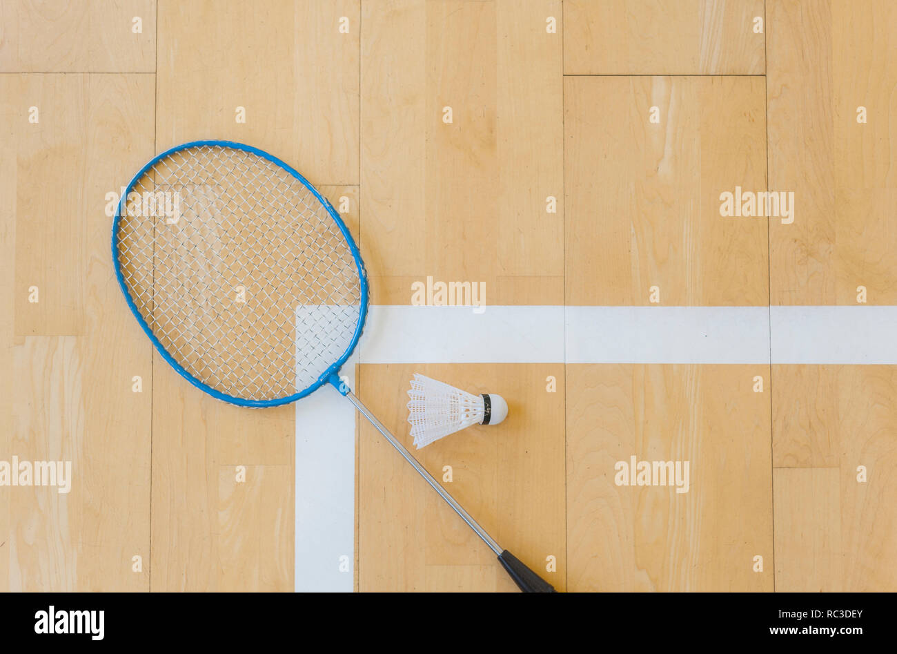 White badminton shuttlecock on a hall floor at badminton courts .Close ...