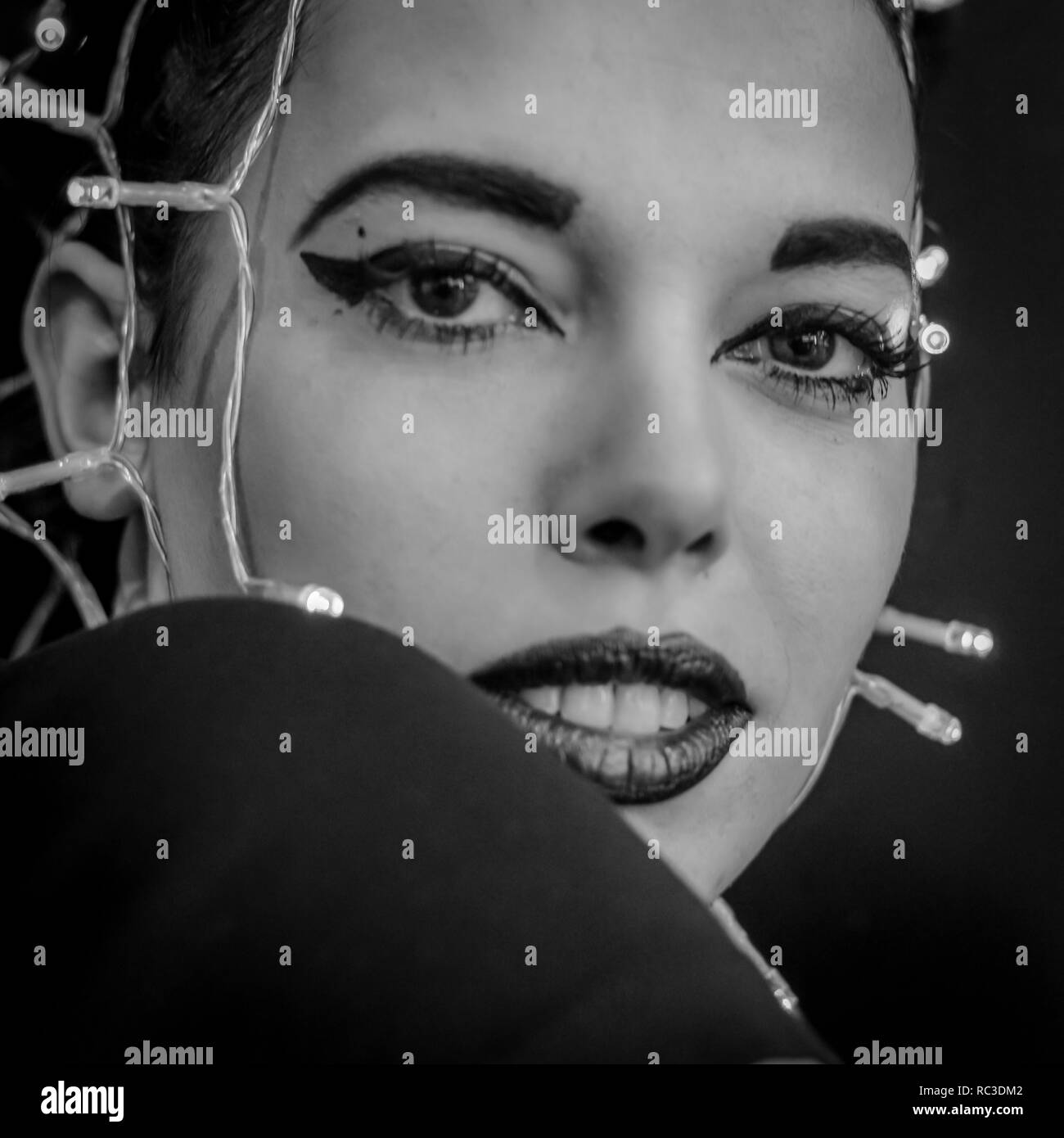 portrait of a young girl with lights over the head Stock Photo - Alamy