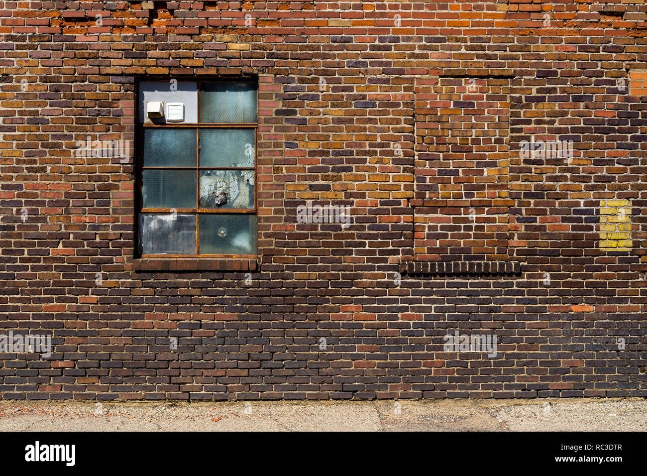 Old brick wall with brick filled window Stock Photo - Alamy