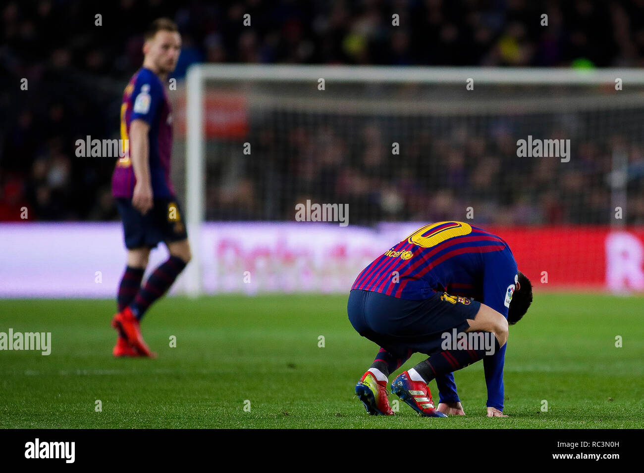 Lionel messi fc barcelona tackle hi-res stock photography and images ...